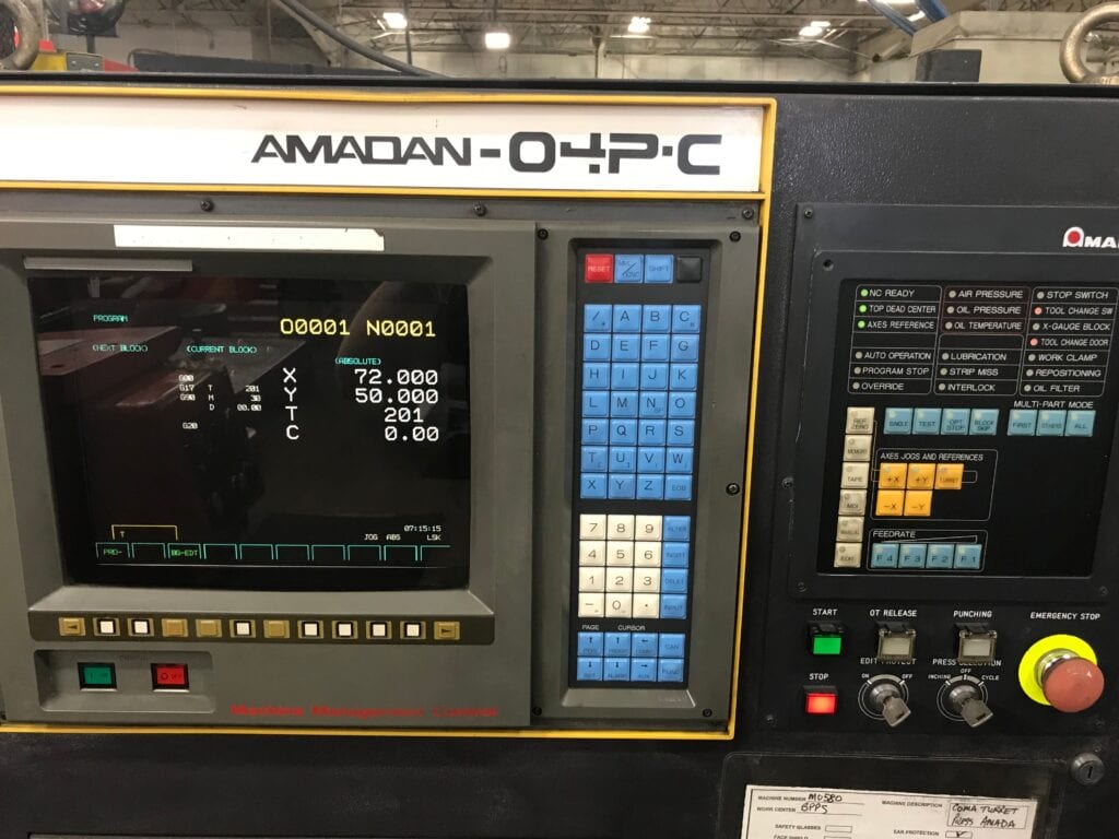 55 Ton Amada Coma-557 CNC Turret Punch, 1994 - Revelation Machinery